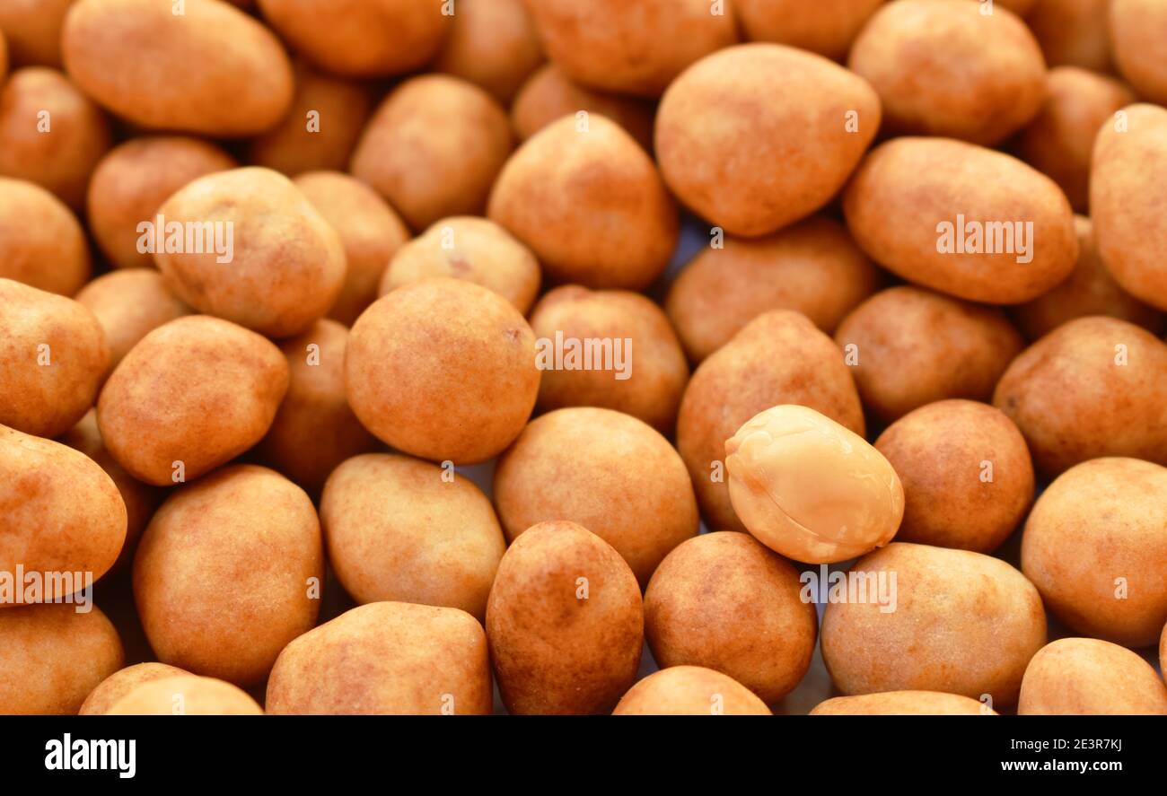 crispy sweet peanut coating coconut milk arranging on white background ...