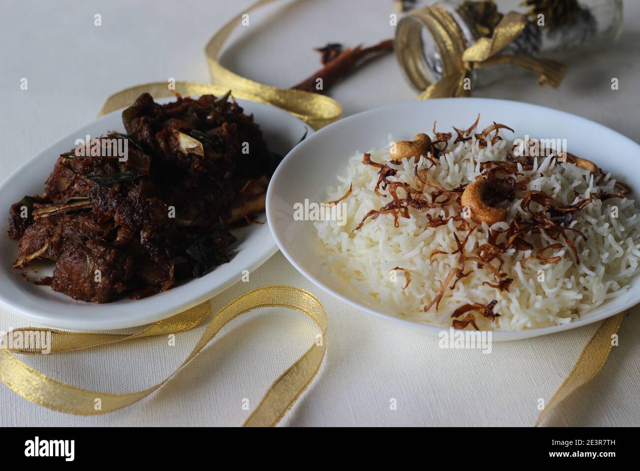 Aromatic traditional Ghee rice and spicy mutton roast prepared in ...