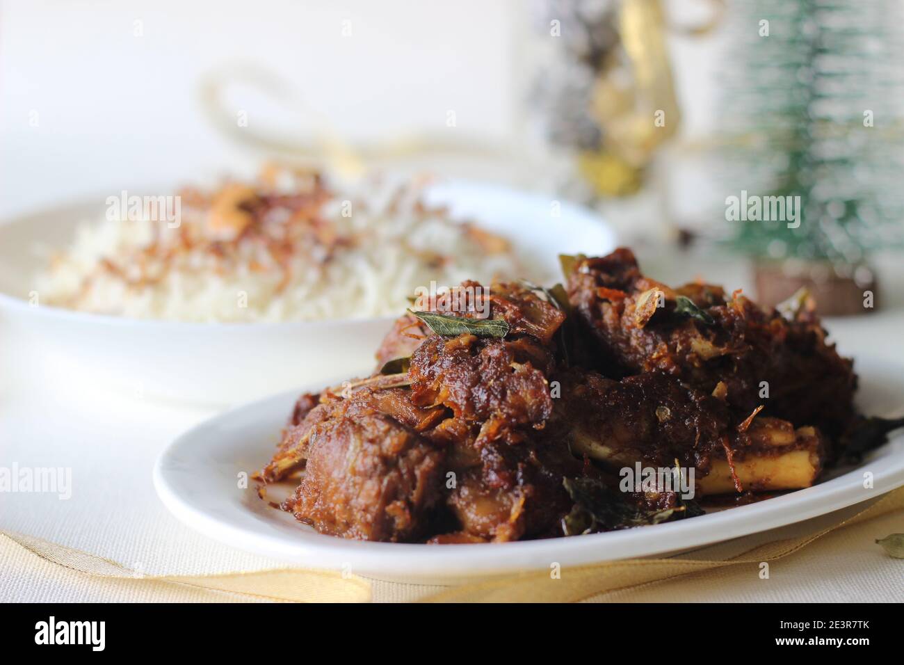 Aromatic traditional Ghee rice and spicy mutton roast prepared in ...