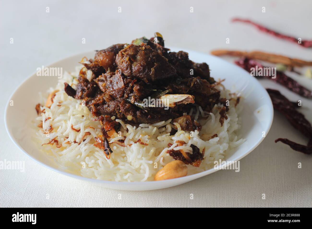 Aromatic traditional Ghee rice and spicy mutton roast prepared in ...