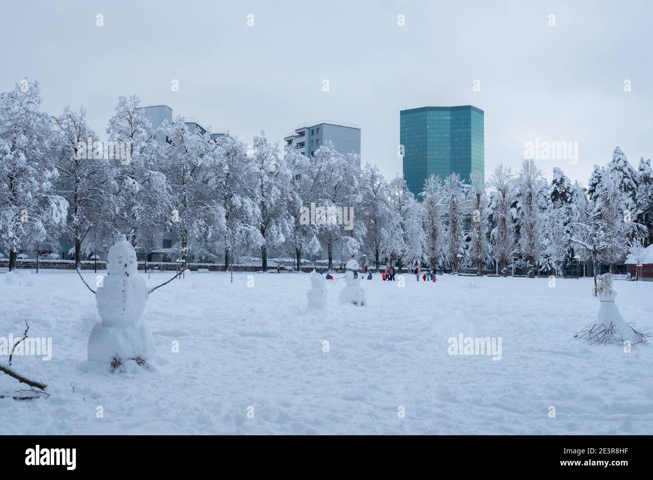 Intense snowfall in Zurich, Switzerland: Snowmen in the park Josefwiese ...