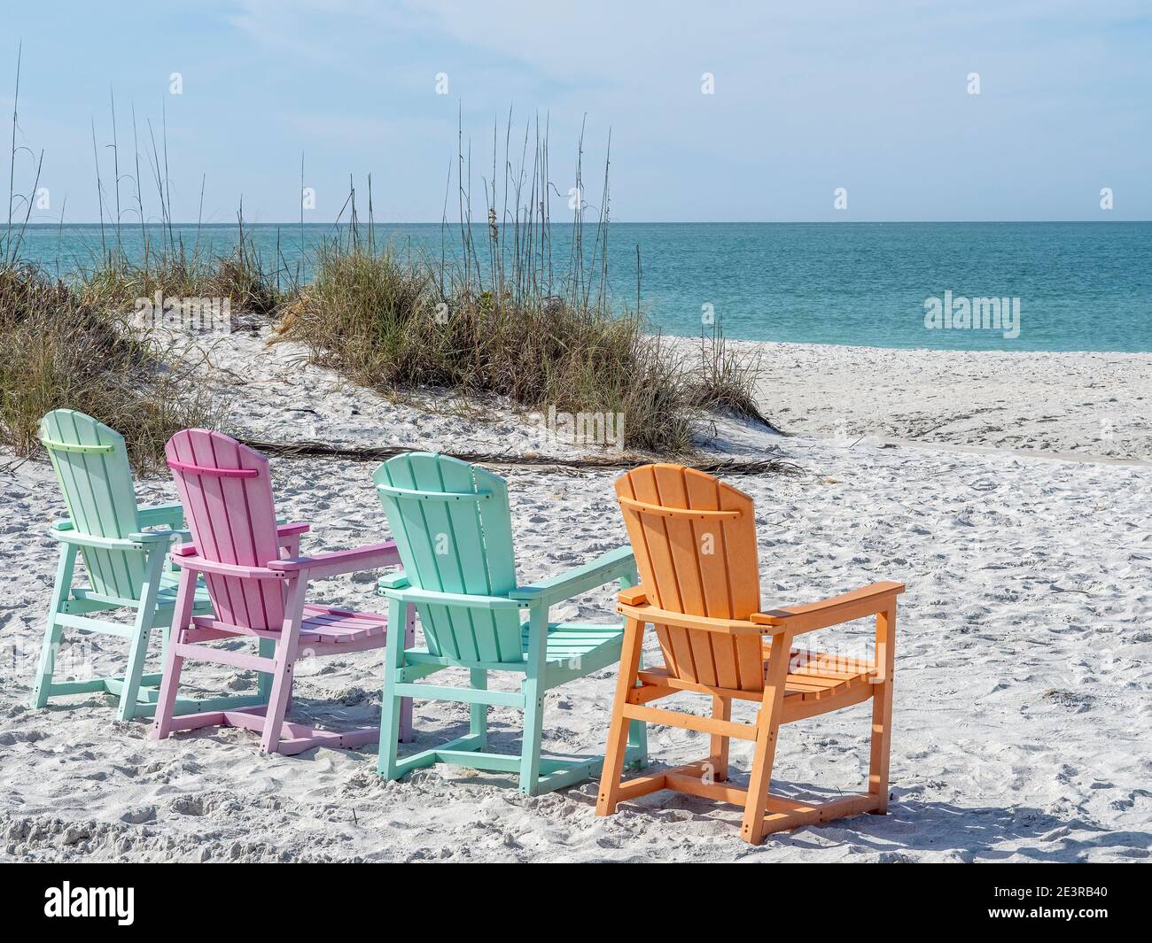 Colorful chairs on the Gulf of Mexico beach at the South Beach Bar ...