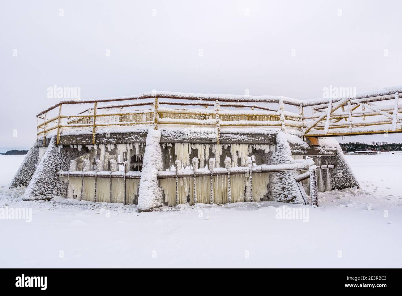 Frozen and snow covered metal dam construction. Extremely Cold Weather ...