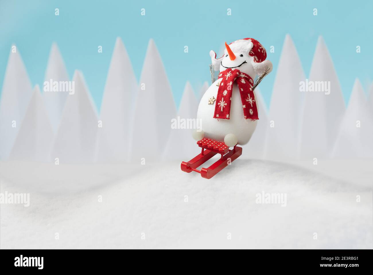 Happy snowman sledding on sleigh in winter christmas landscape. Merry ...