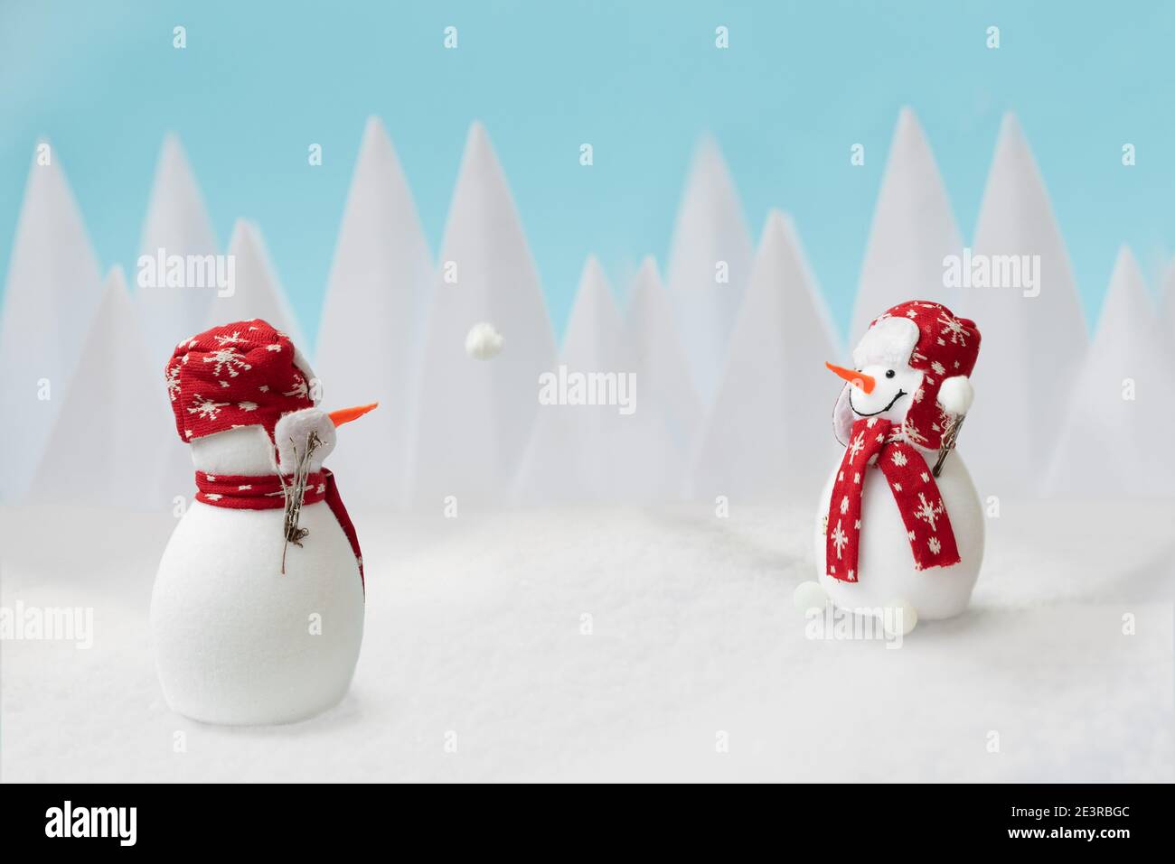 Happy snowmen playing snowballs in winter christmas landscape. Merry ...