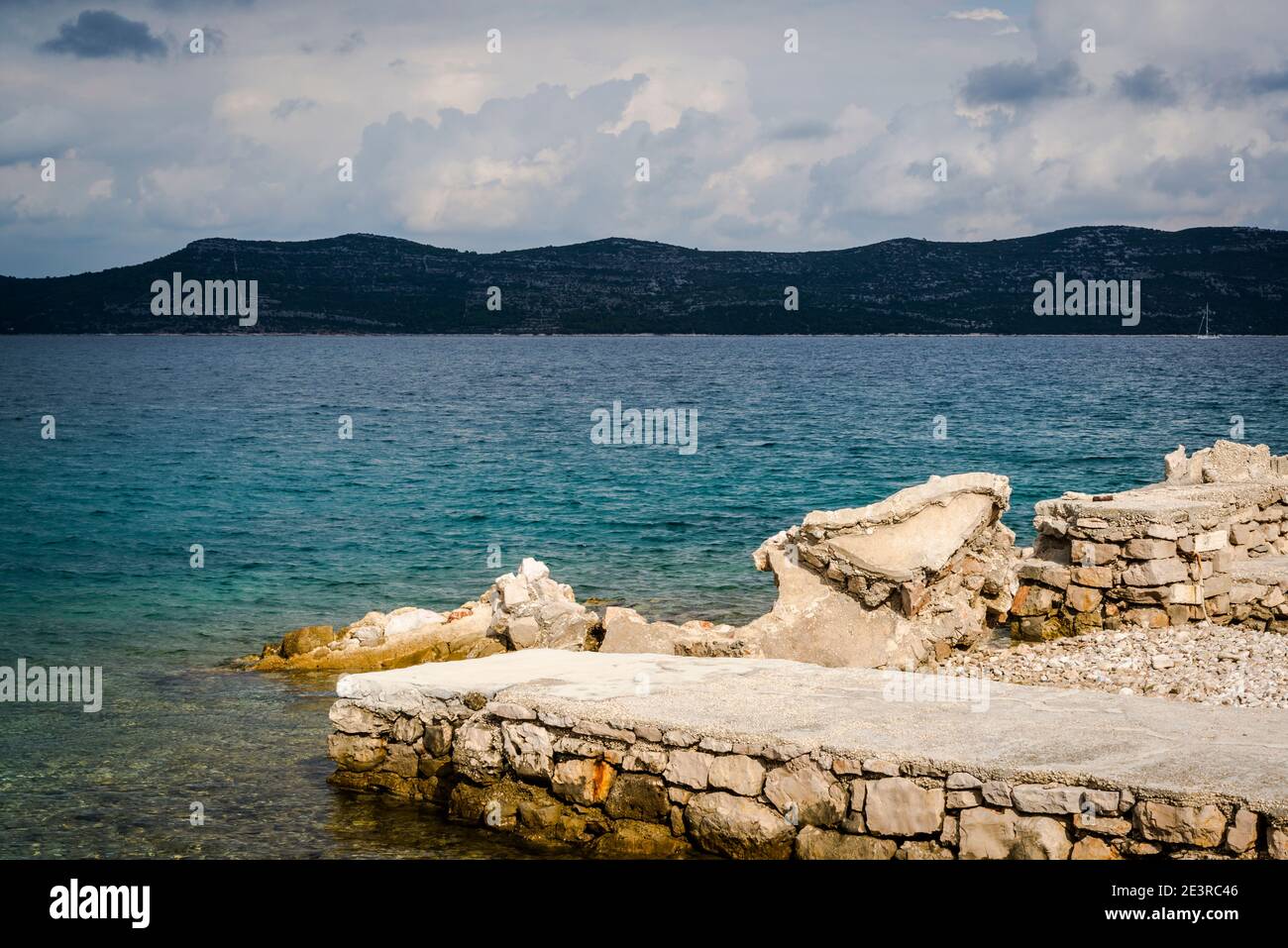 Seascape and broken pier wall, Mali Iz, Island of Iz, Zadar archipelago ...