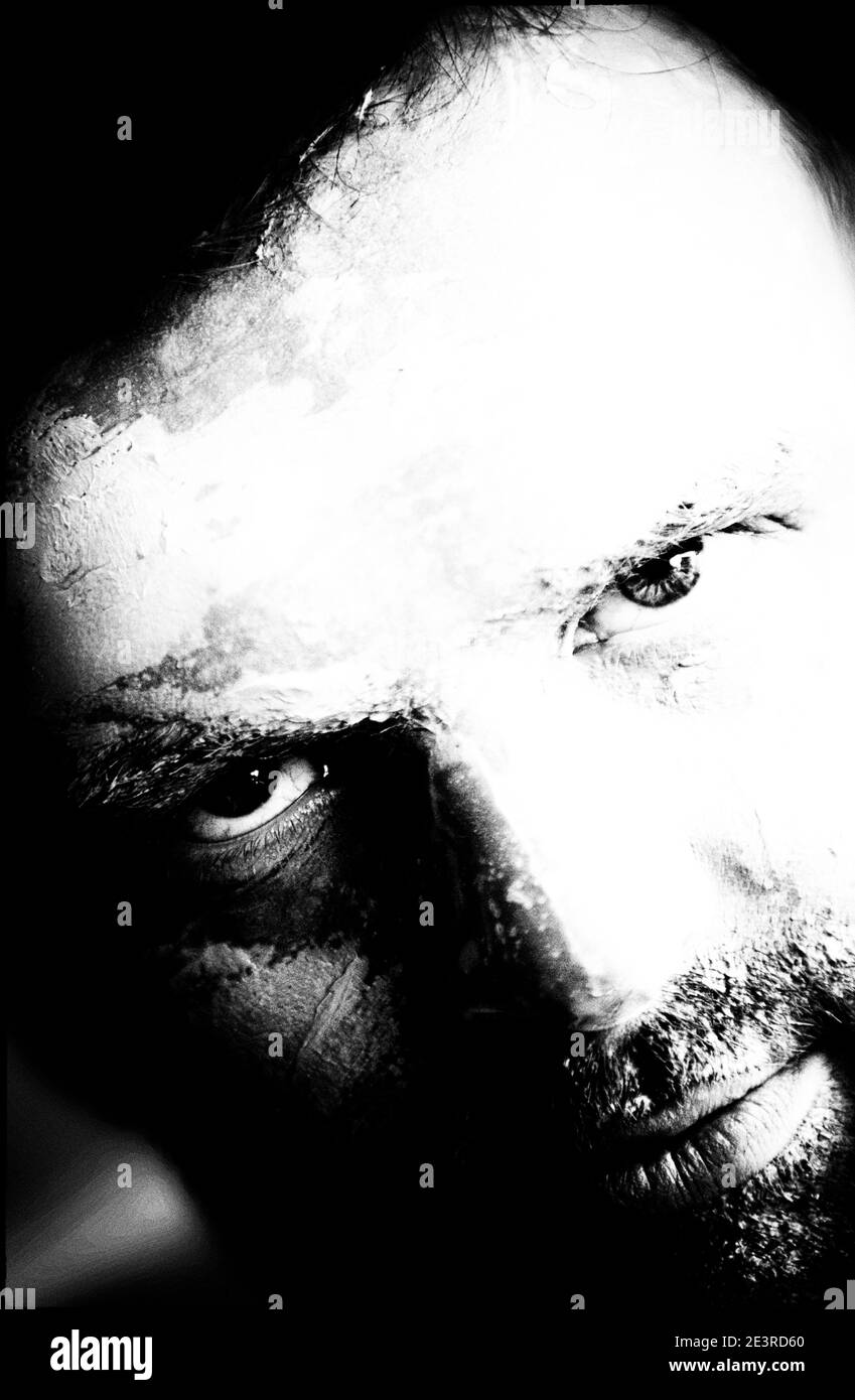 graphic mono portrait of young man looking into camera Stock Photo - Alamy