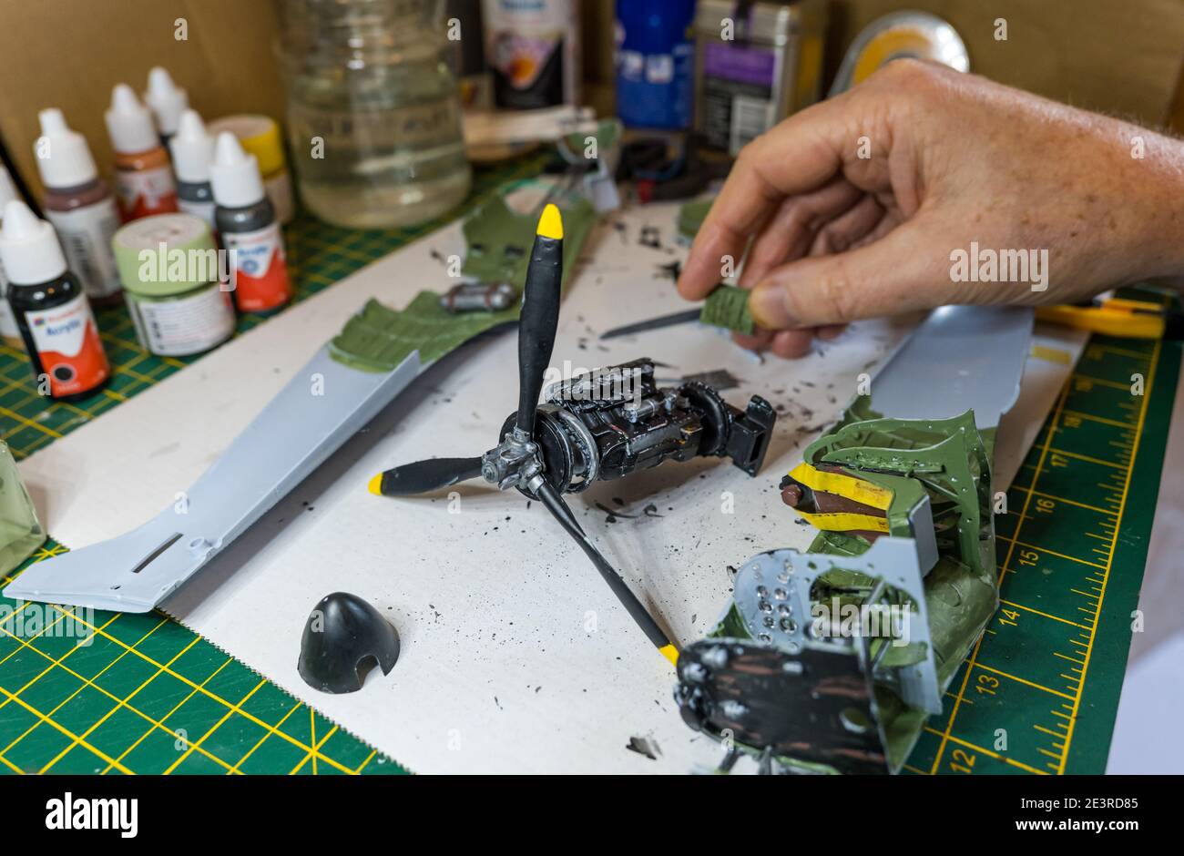 Man constructing engine of Airfix Spitfire model aeroplane 1/24th in ...