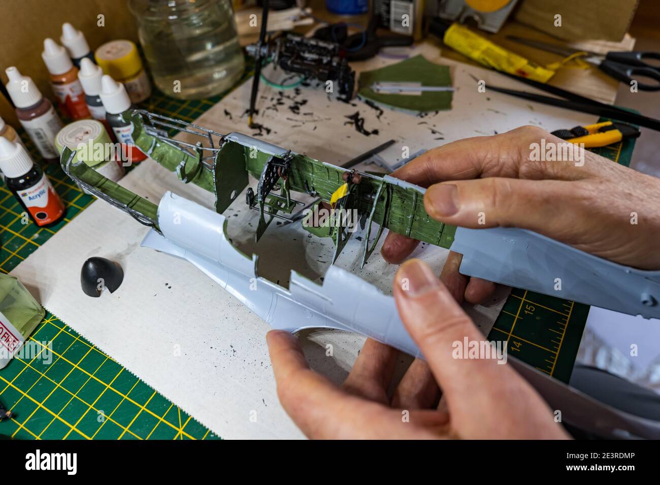 Man constructing engine of Airfix Spitfire model aeroplane 1/24th in ...