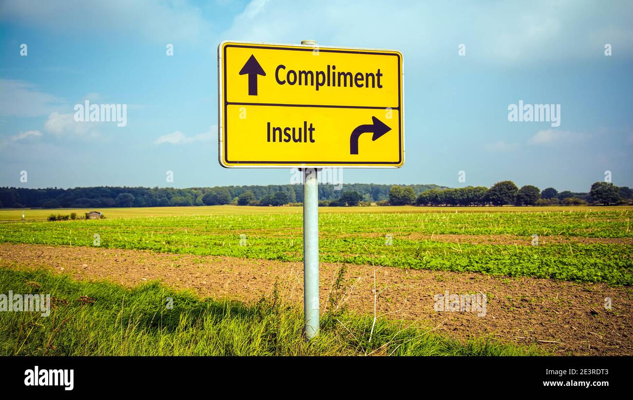 Street Sign the Direction Way to Compliment versus Insult Stock Photo ...