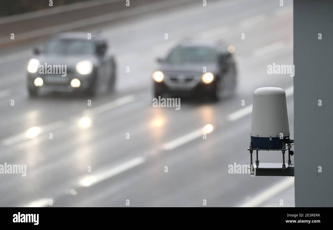 Vehicles pass a Stopped Vehicle Detection radar sensor mounted adjacent ...