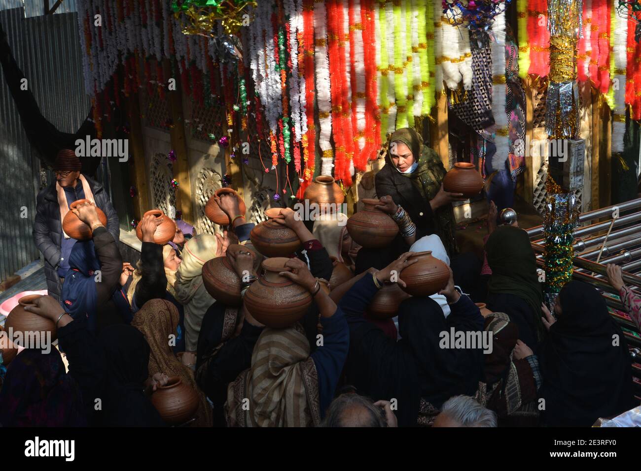 Pakistani women devotees bringing water for ablution of the graves at ...