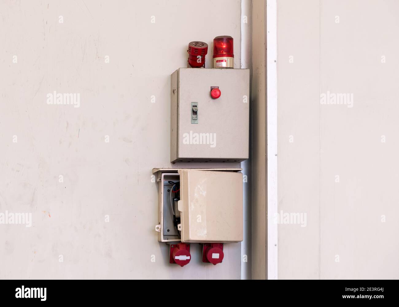 The warning red light and siren of the alarm system near the control ...