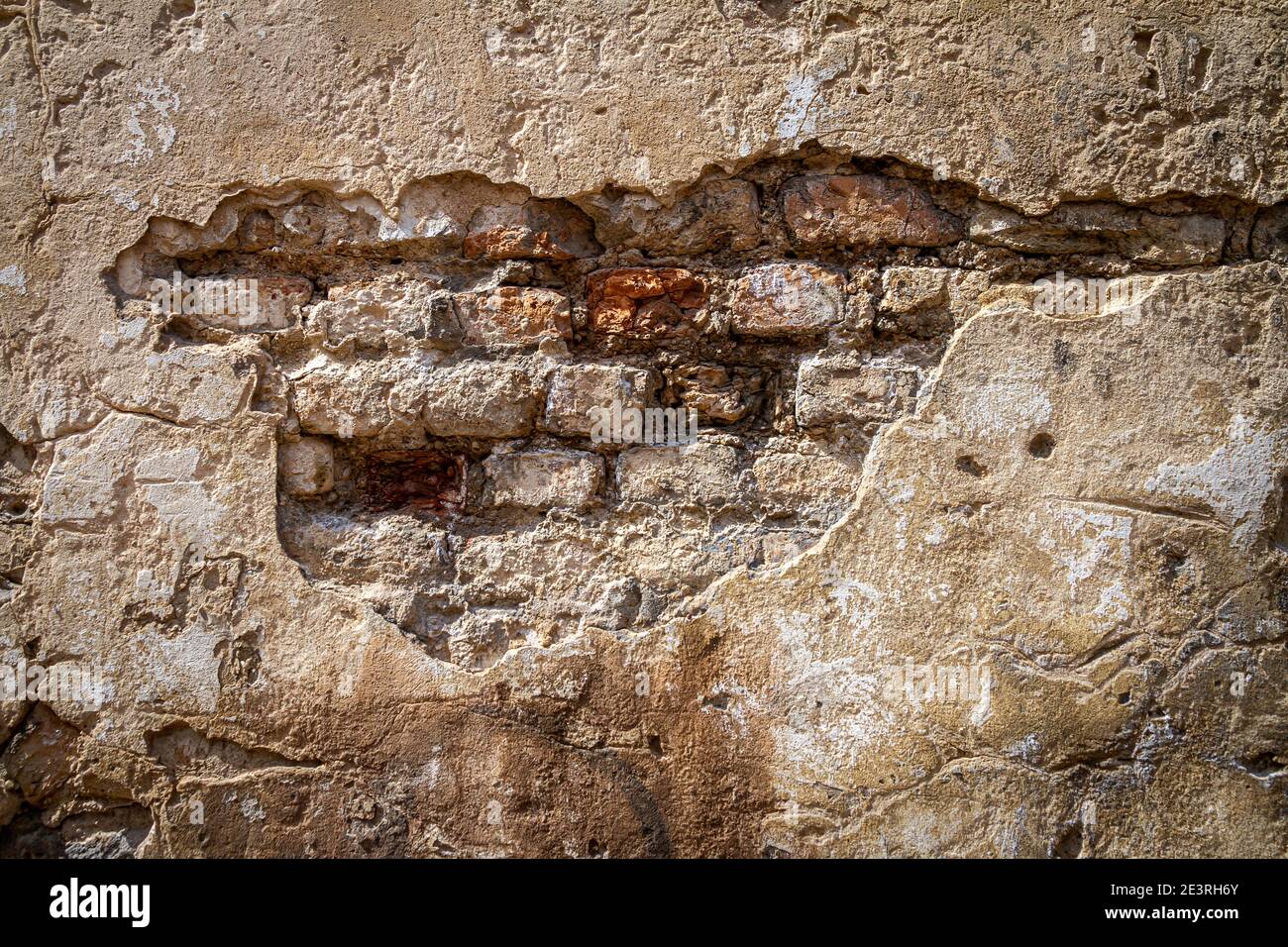 Old brick and plaster wall texture background. Painted distressed wall ...