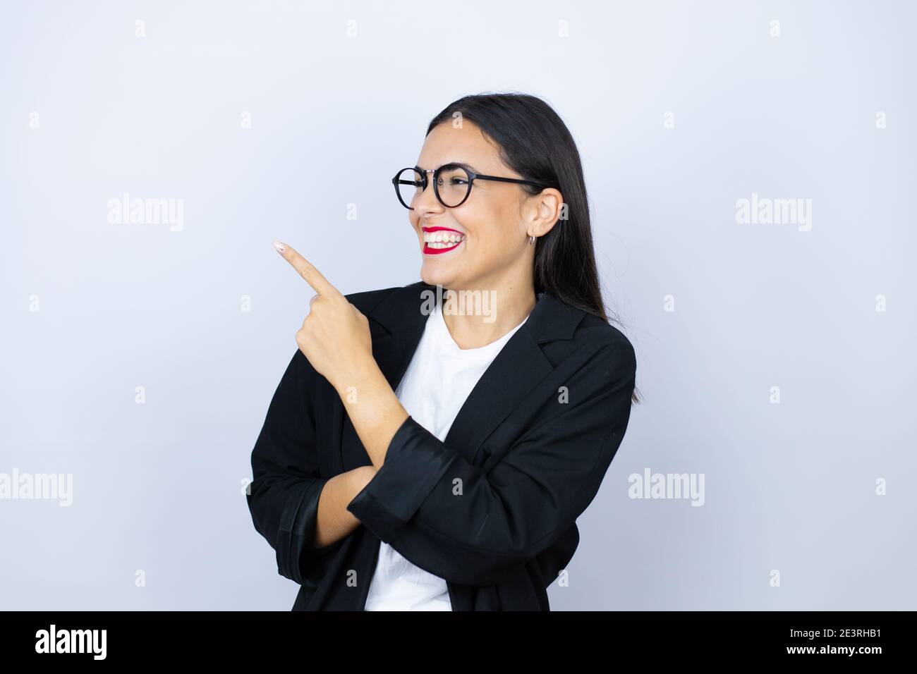 Beautiful business woman confused and pointing with hand and finger to ...