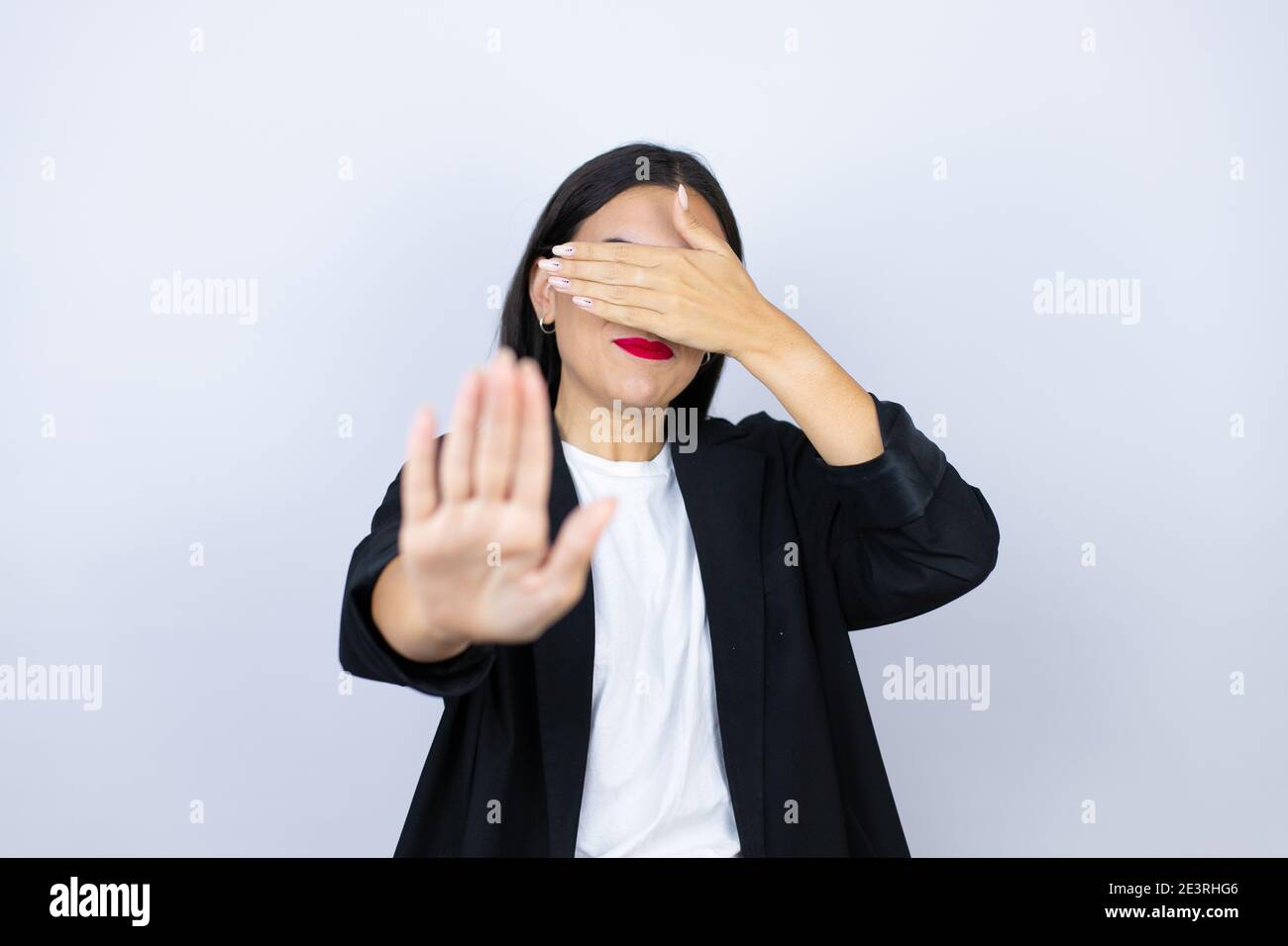 Beautiful business woman covering eyes with hands and doing stop ...