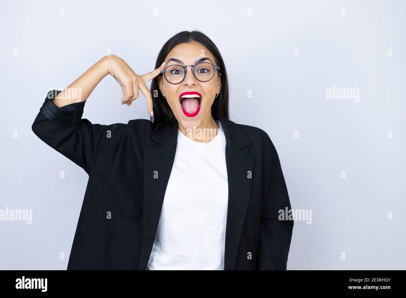 Beautiful business woman smiling and thinking with her fingers on her ...