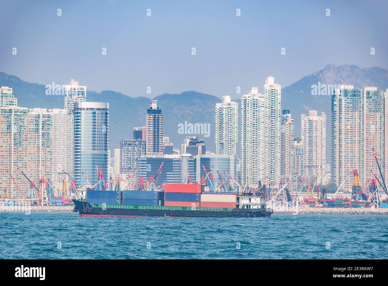 Freight container ship by Hong Kong commercial port Stock Photo - Alamy