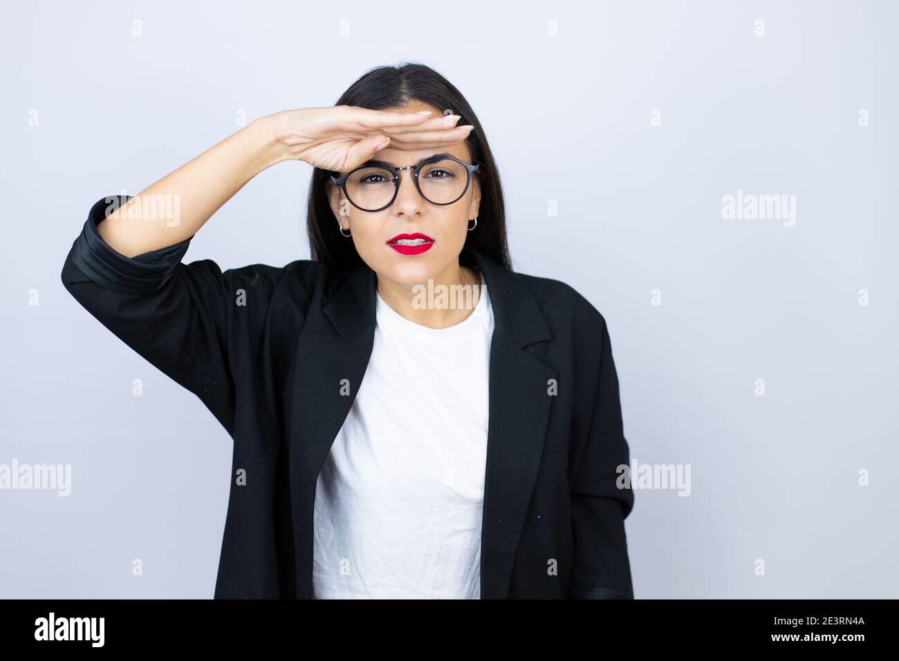 Beautiful business woman very happy and smiling looking far away with ...