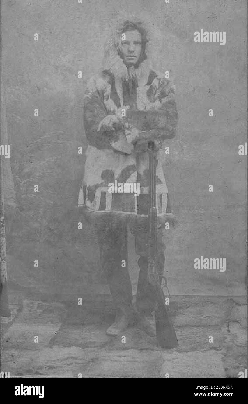 Man wearing fur parka posing with rifle, Alaska, 1893-1910 (AL+CA 1685 ...