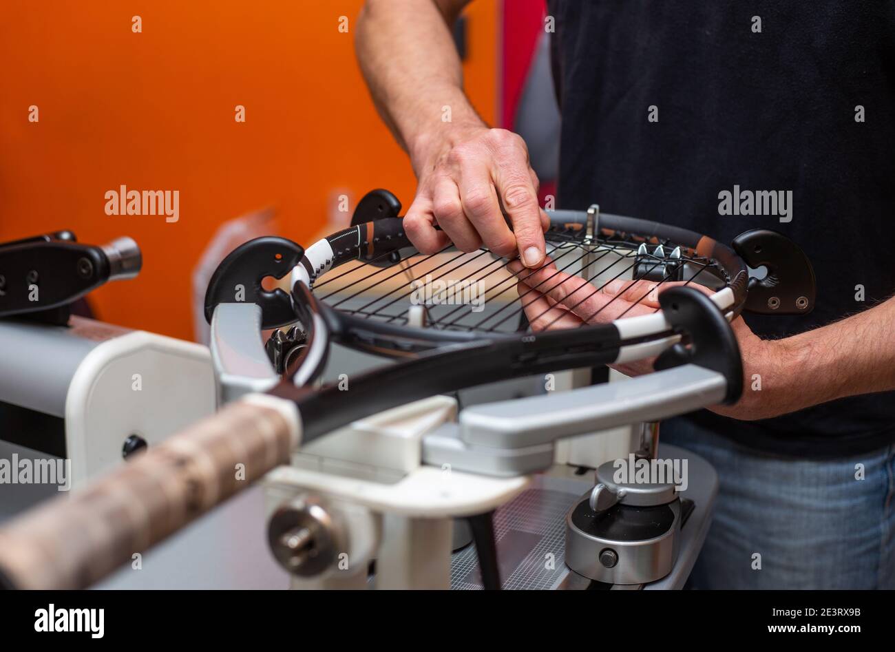 The process of stringing a tennis racket in a tennis shop Stock Photo ...