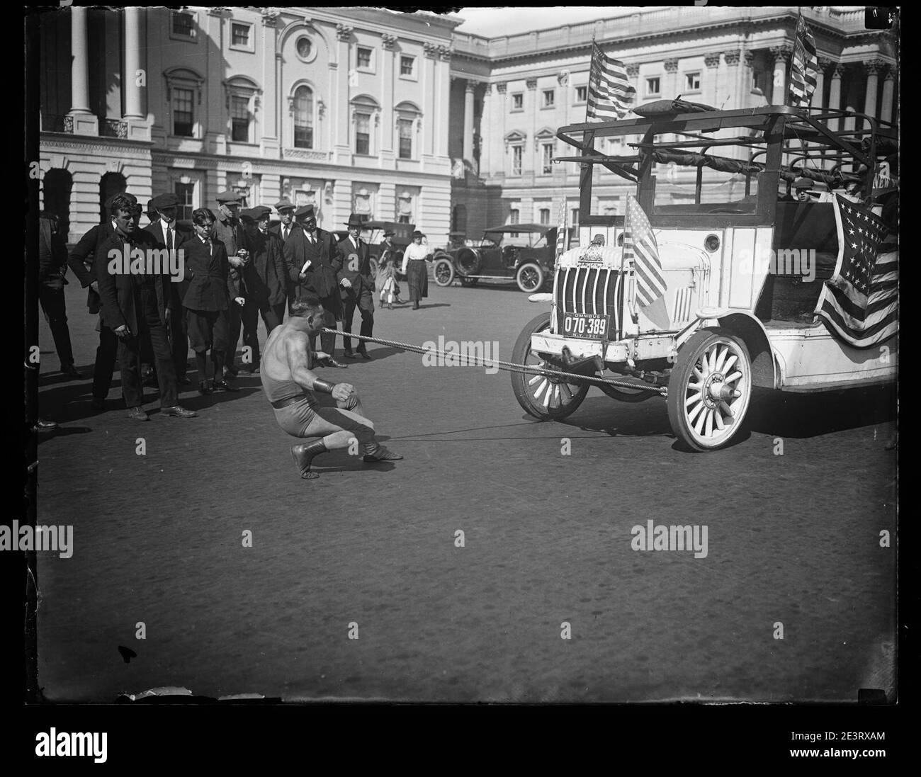 Man pulling bus with teeth outside U.S. Capitol, Washington, D.C Stock ...