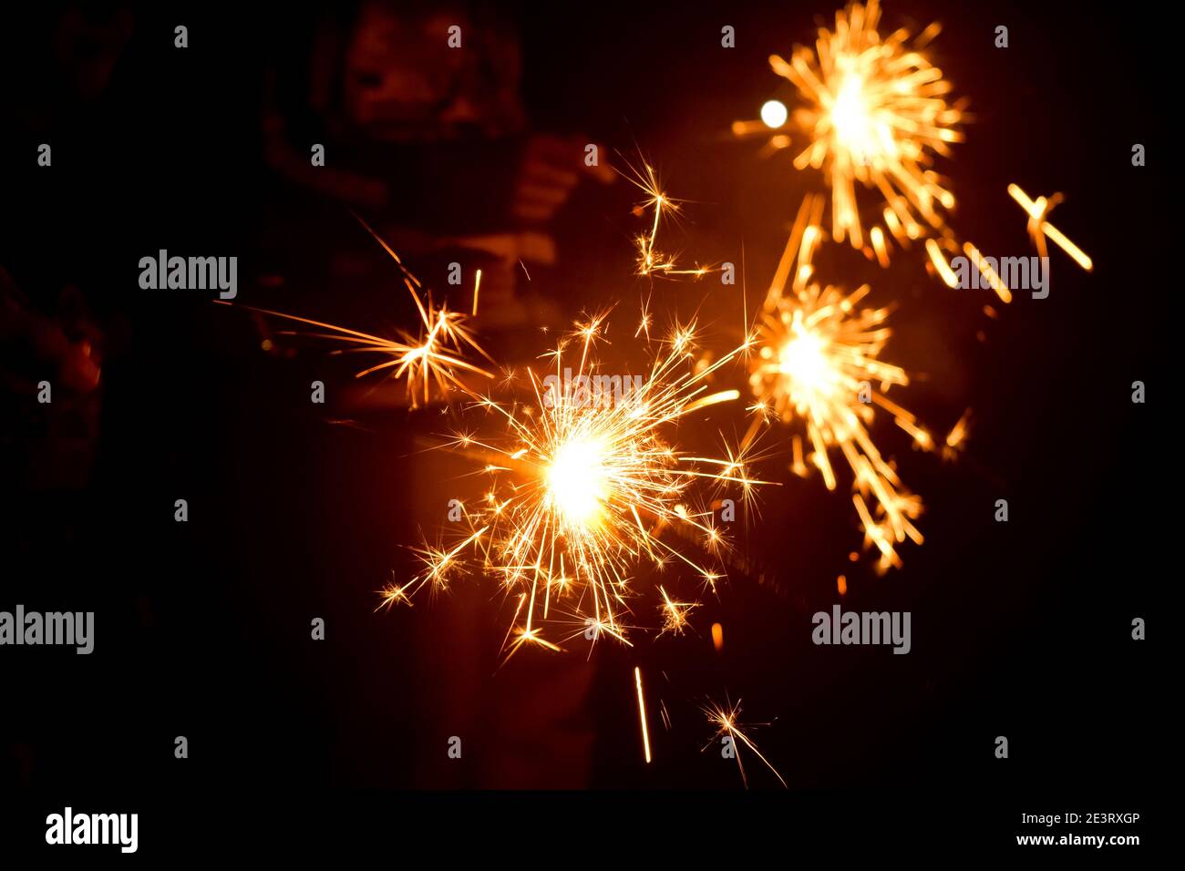 Sparkel sticks which are fireworks lightening during the celebration of ...