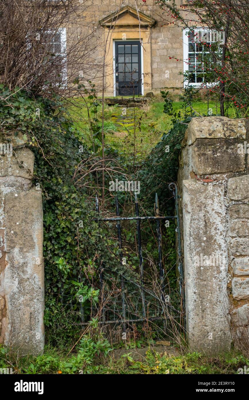 Old metal small gate of a village house Stock Photo - Alamy