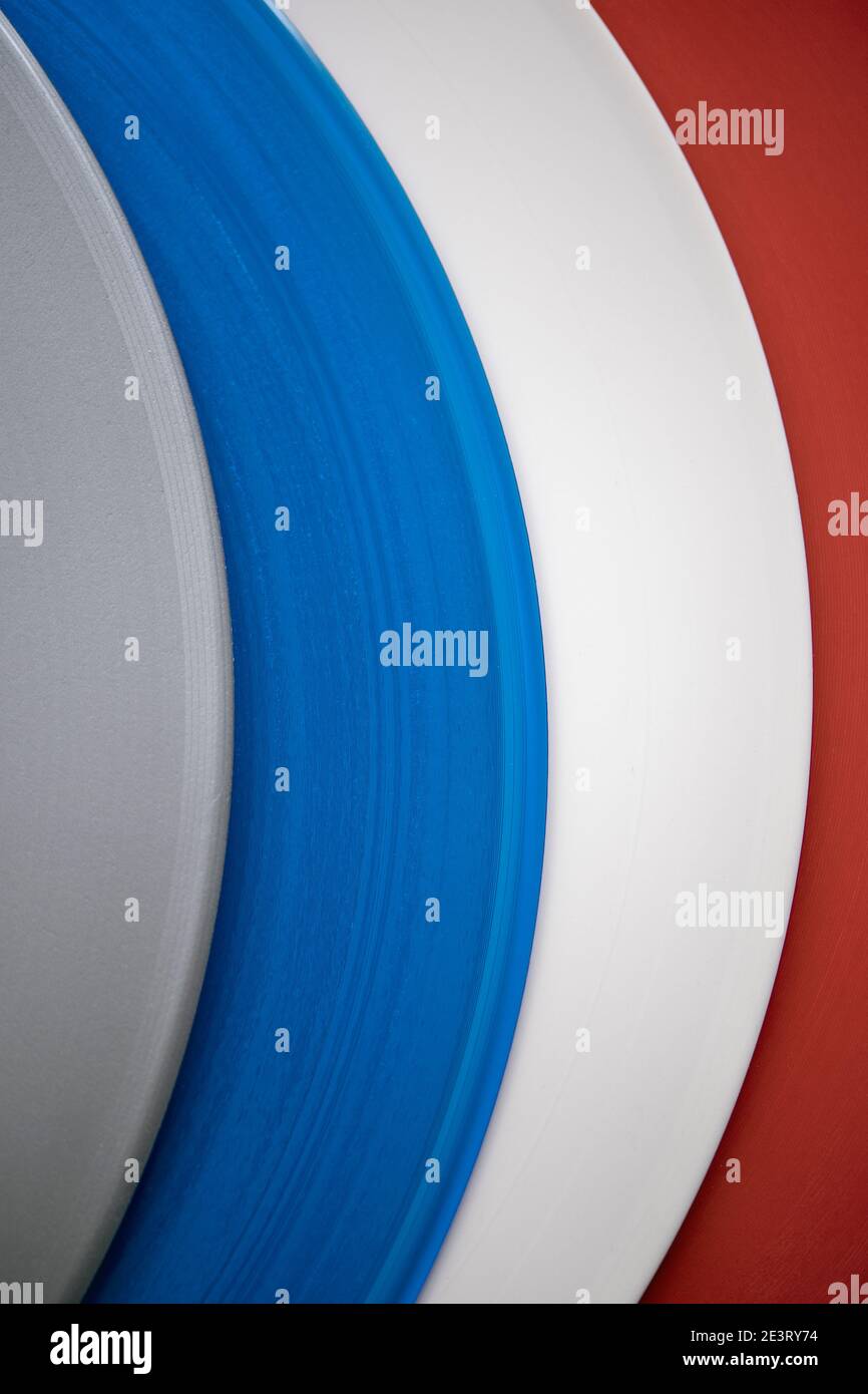A collection of different coloured vinyl records Stock Photo - Alamy