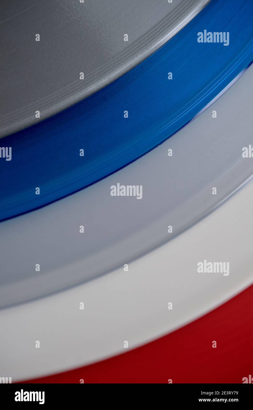 A collection of different coloured vinyl records Stock Photo - Alamy