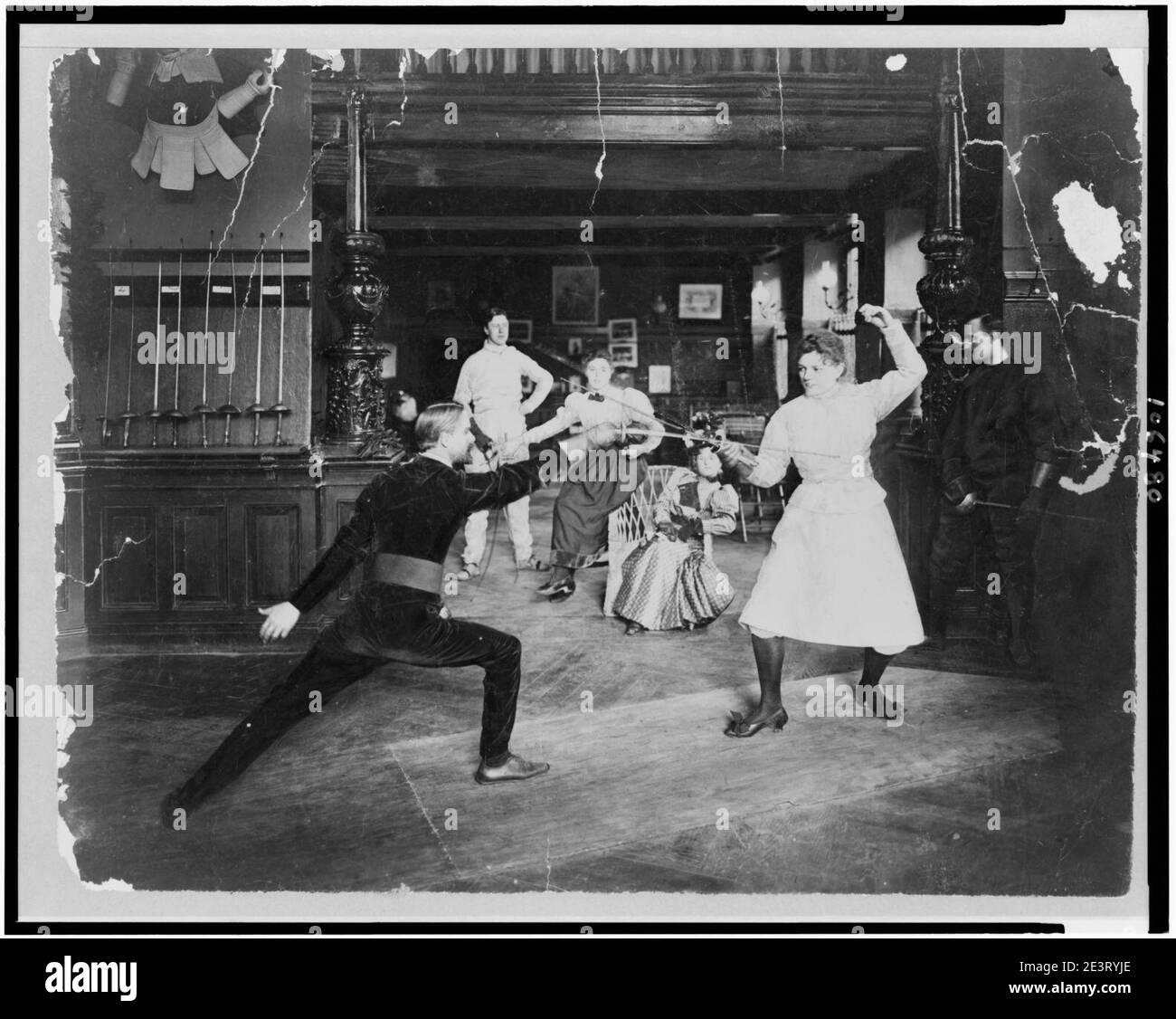 Man and woman fencing Stock Photo - Alamy