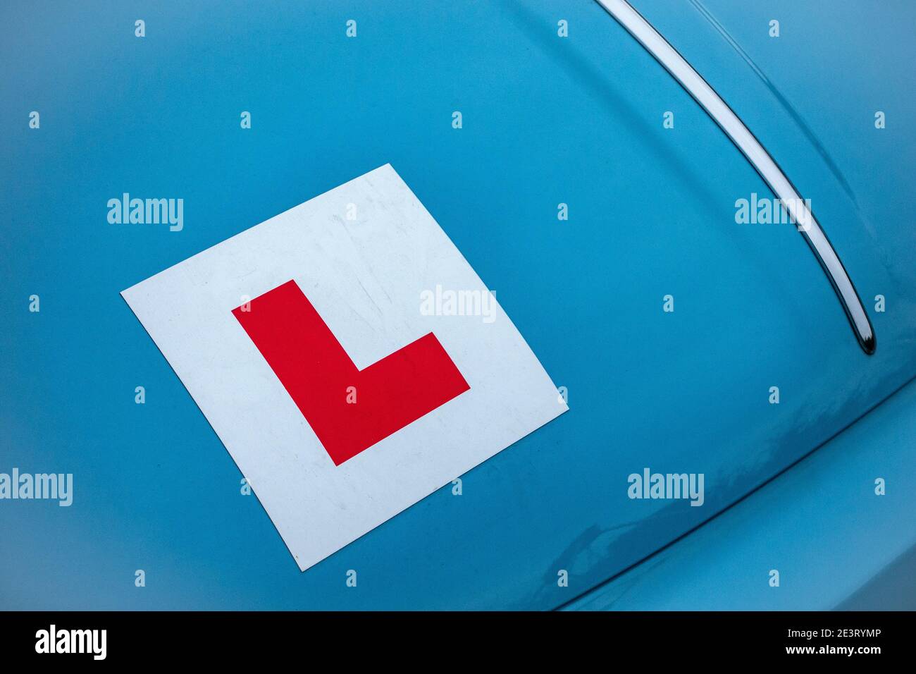 Learner driver L plate on small blue Fiat car bonnet Stock Photo - Alamy