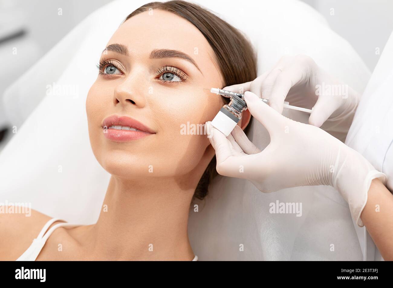 Injections into the eye area. facial rejuvenation, wrinkle removal ...