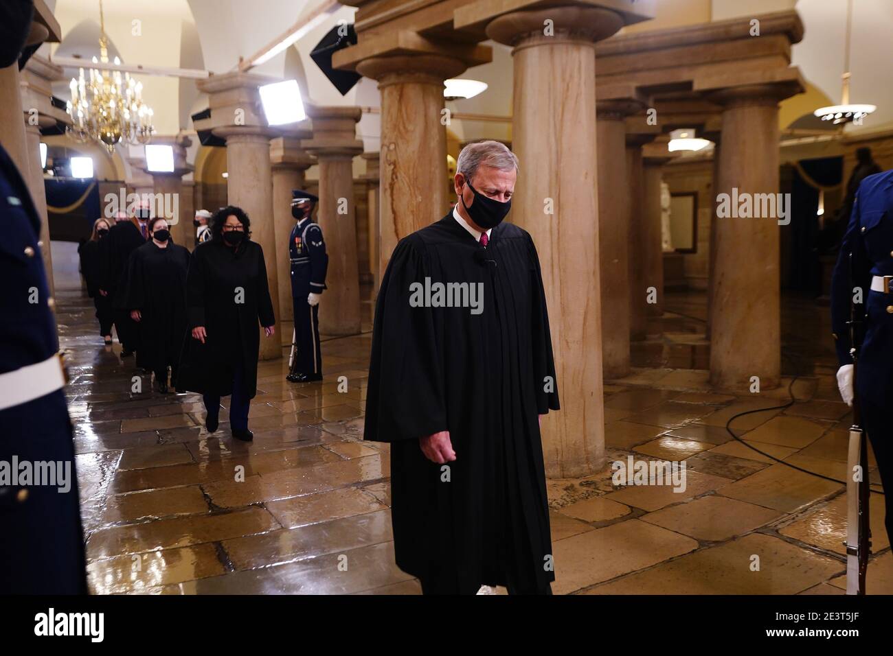 Chief Justice John Roberts leads the US Supreme Court Justices as they ...