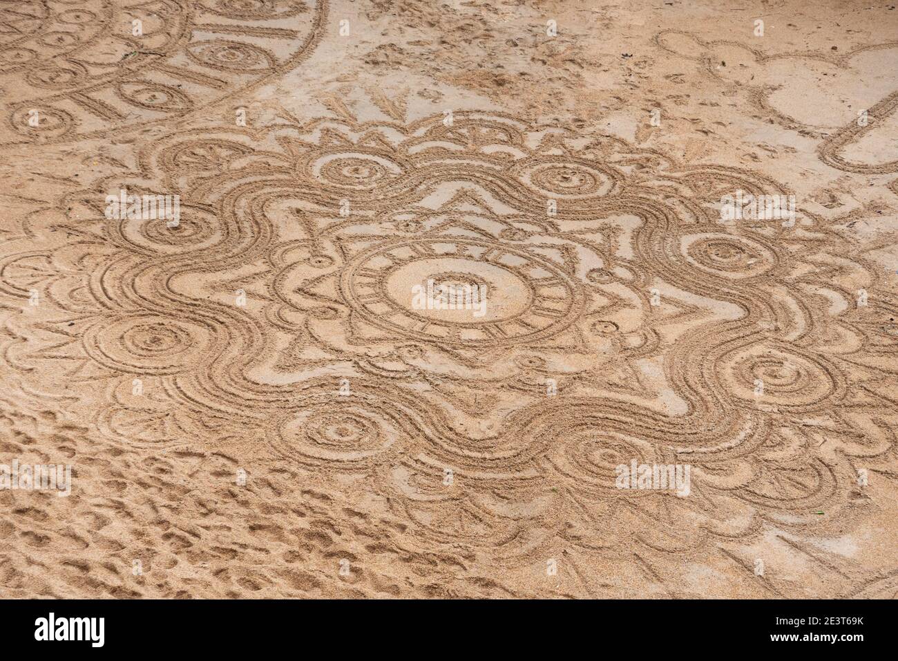 Decorative abstract geometric drawings on the sand. Beach vacation ...