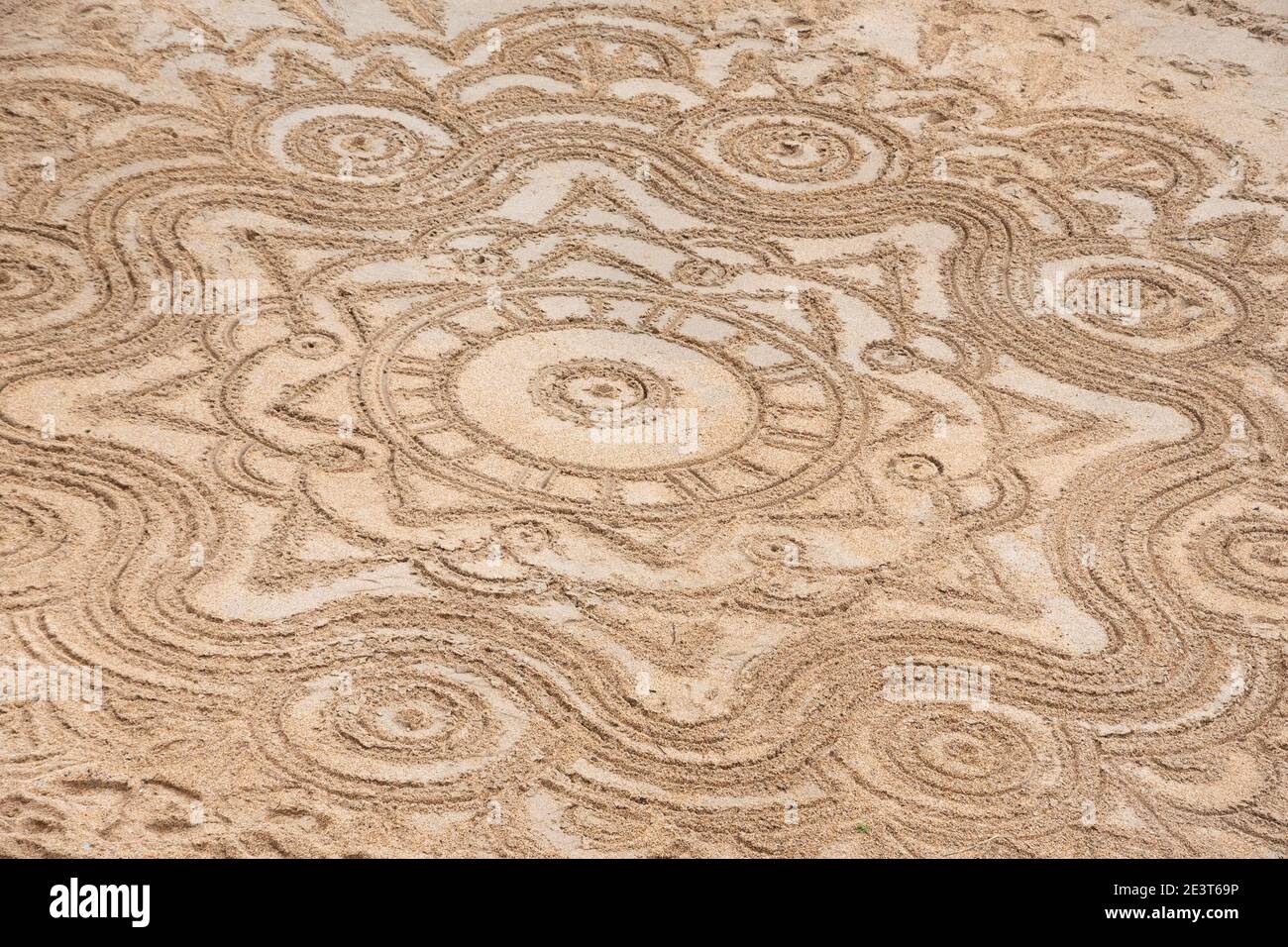 Decorative abstract geometric drawings on the sand. Beach vacation ...