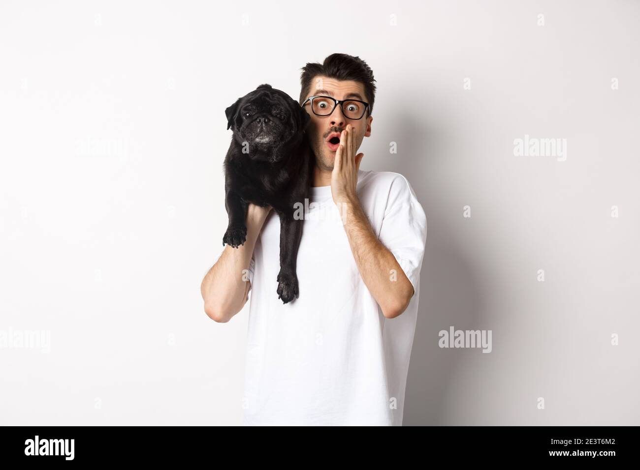 Image of shocked dog owner staring at camera and gasping impressed ...