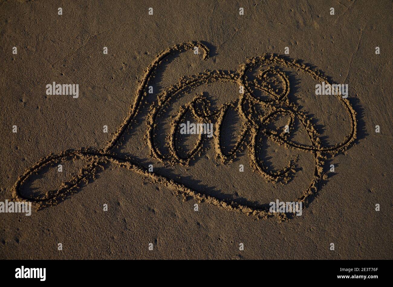 Alphabet writing on sand letter hi-res stock photography and images - Alamy