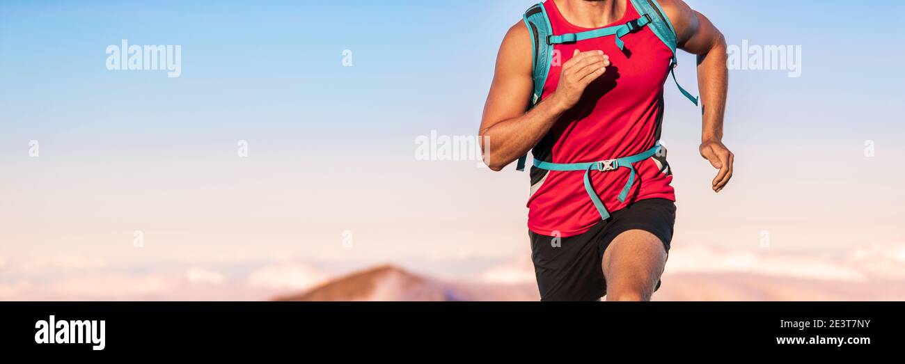 Athlete runner man running fast with backpack outdoors on blue sunset ...