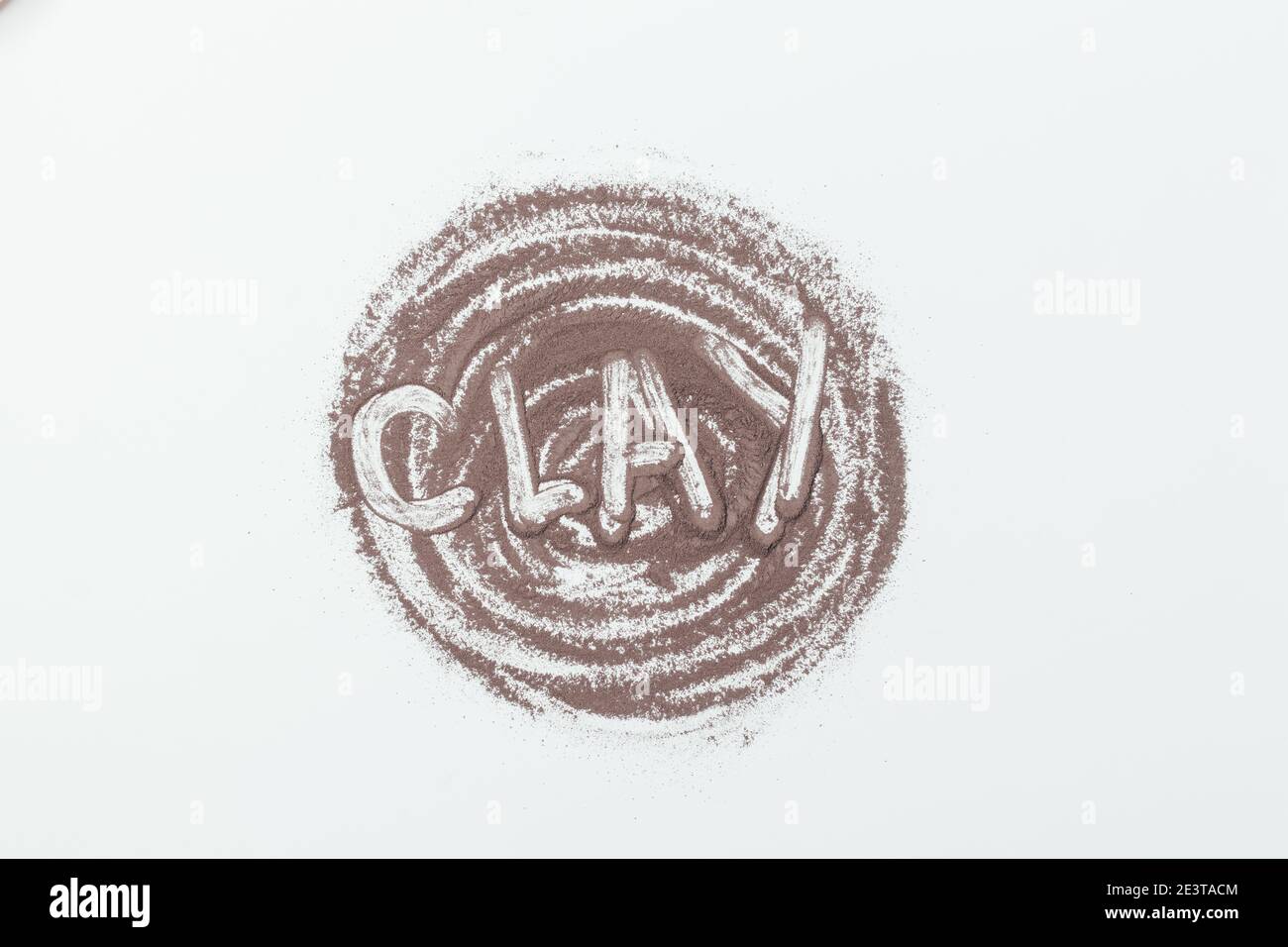 Word written in white powder hi-res stock photography and images - Alamy