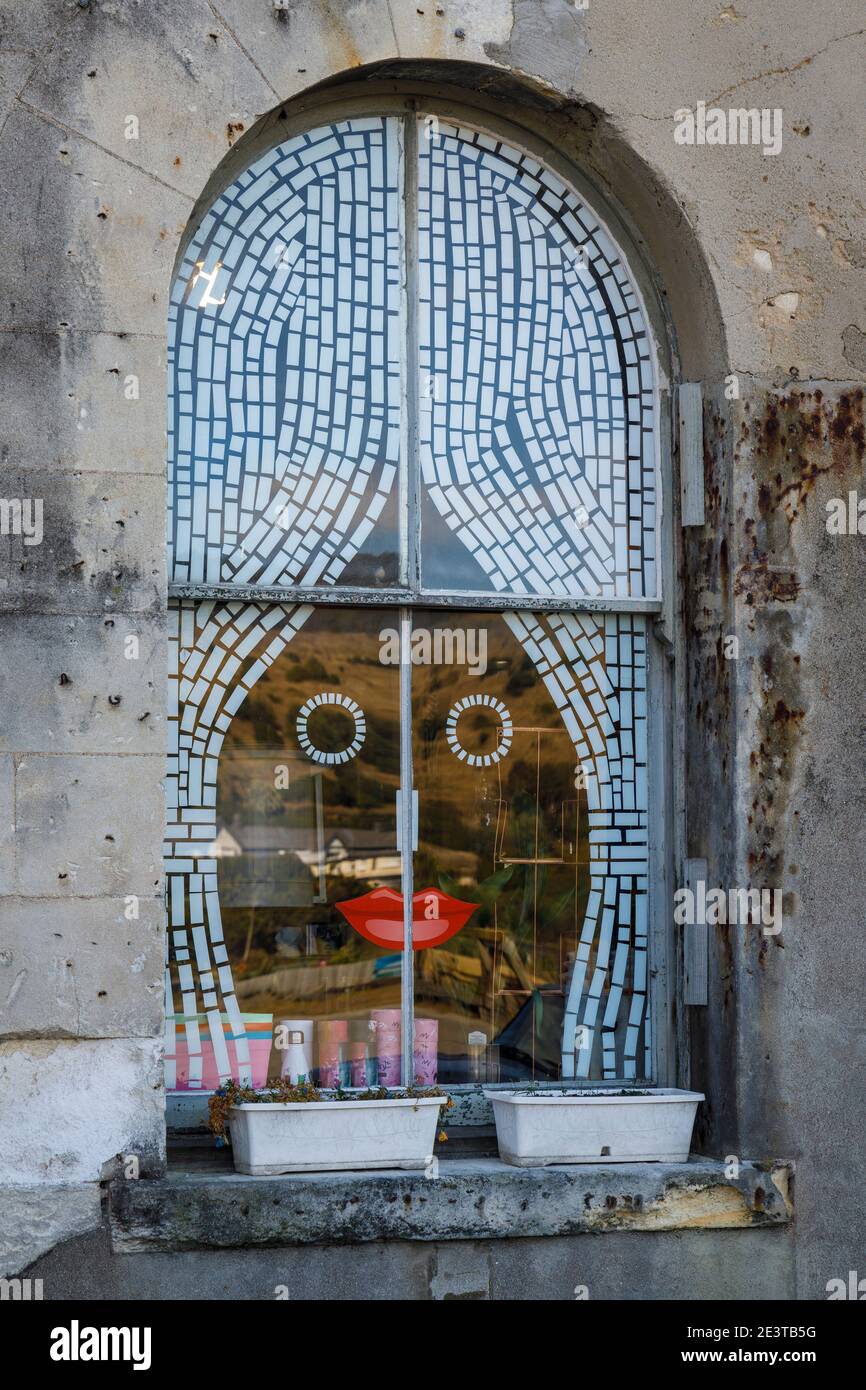 Humorous shop window decoration featuring a woman's face with red lips ...