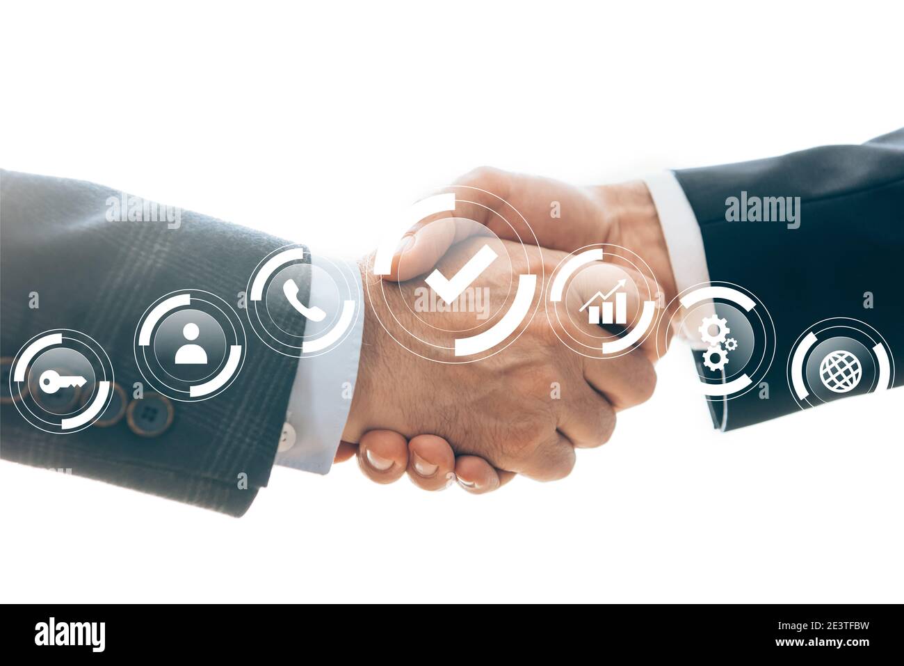 Cropped view of businessmen shaking hands and approval, key and globe ...