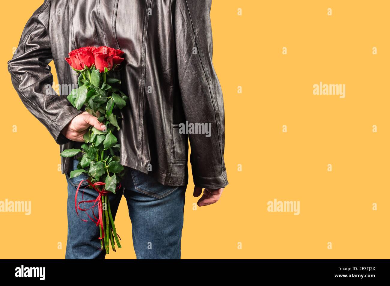 Man holding roses behind back hi-res stock photography and images - Alamy