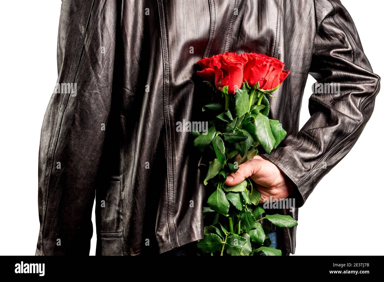 Man with a bouquet of red roses behind his back. Elegant man holding ...