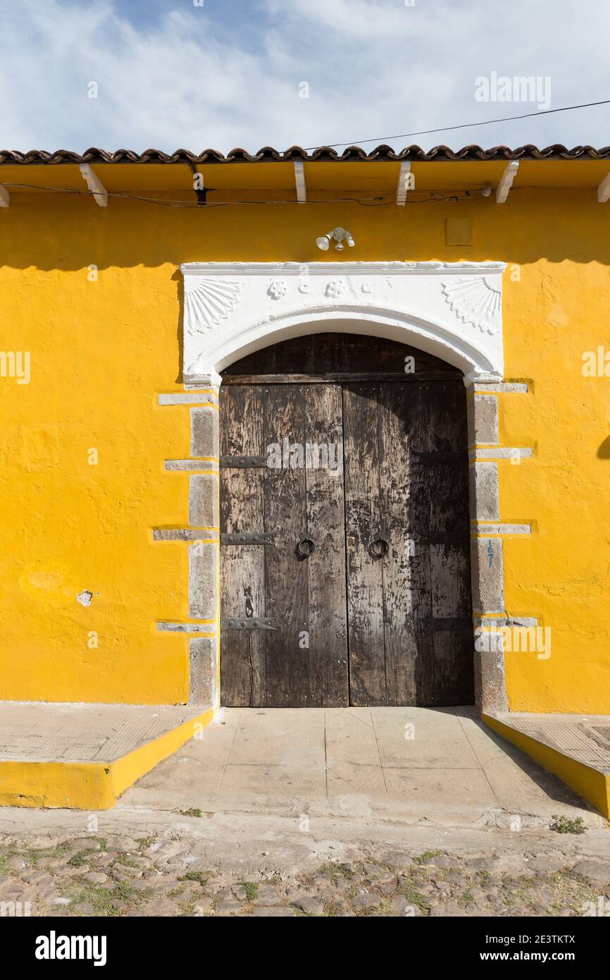 El Salvador Suchitto Colorful yellow colonial style stucco house with ...