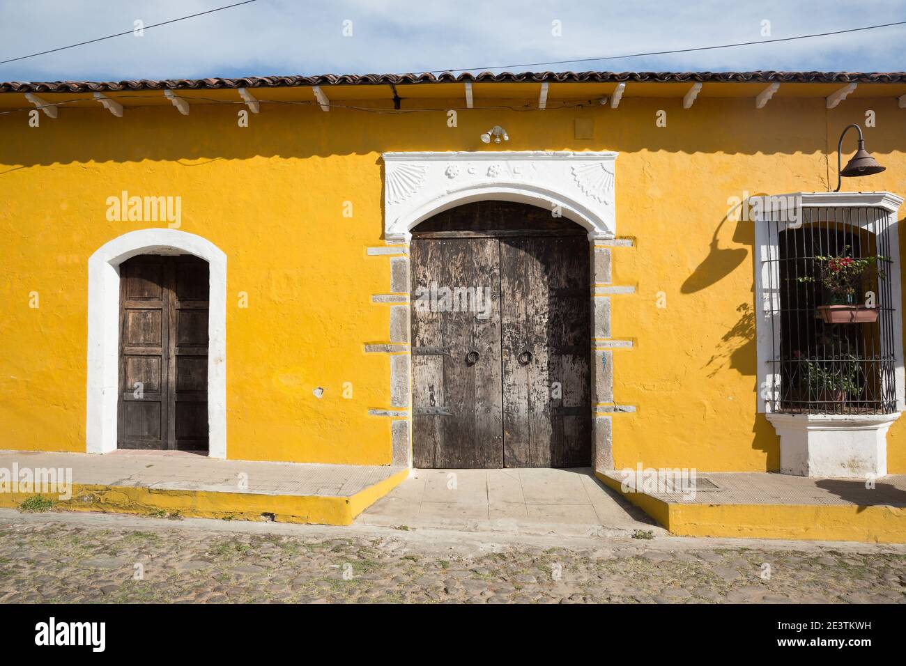 El Salvador Suchitto Colorful yellow colonial style stucco house with ...
