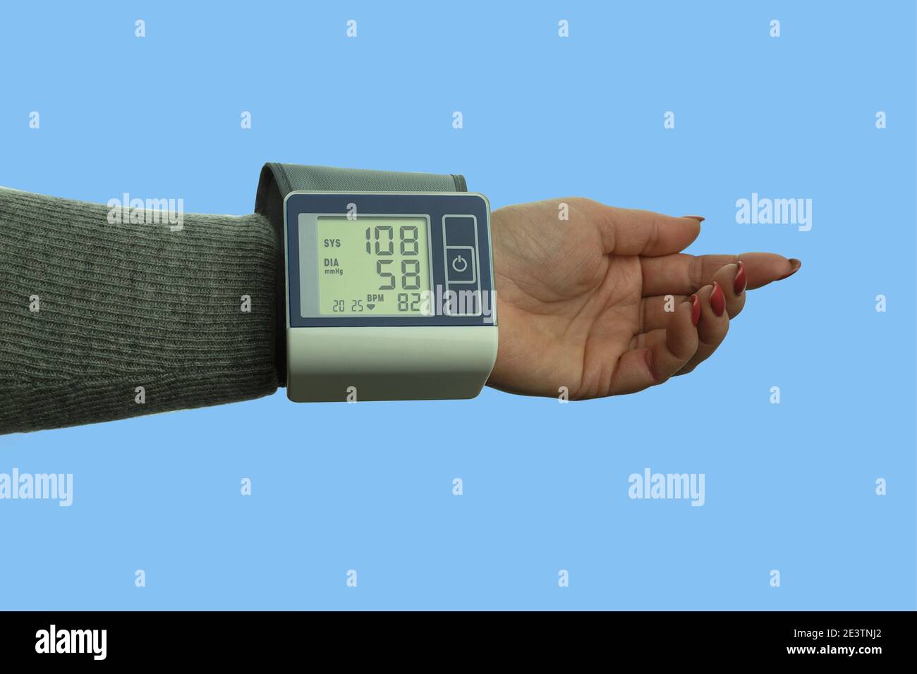 Blood pressure monitor on a woman's hand. Low blood pressure. Woman's ...