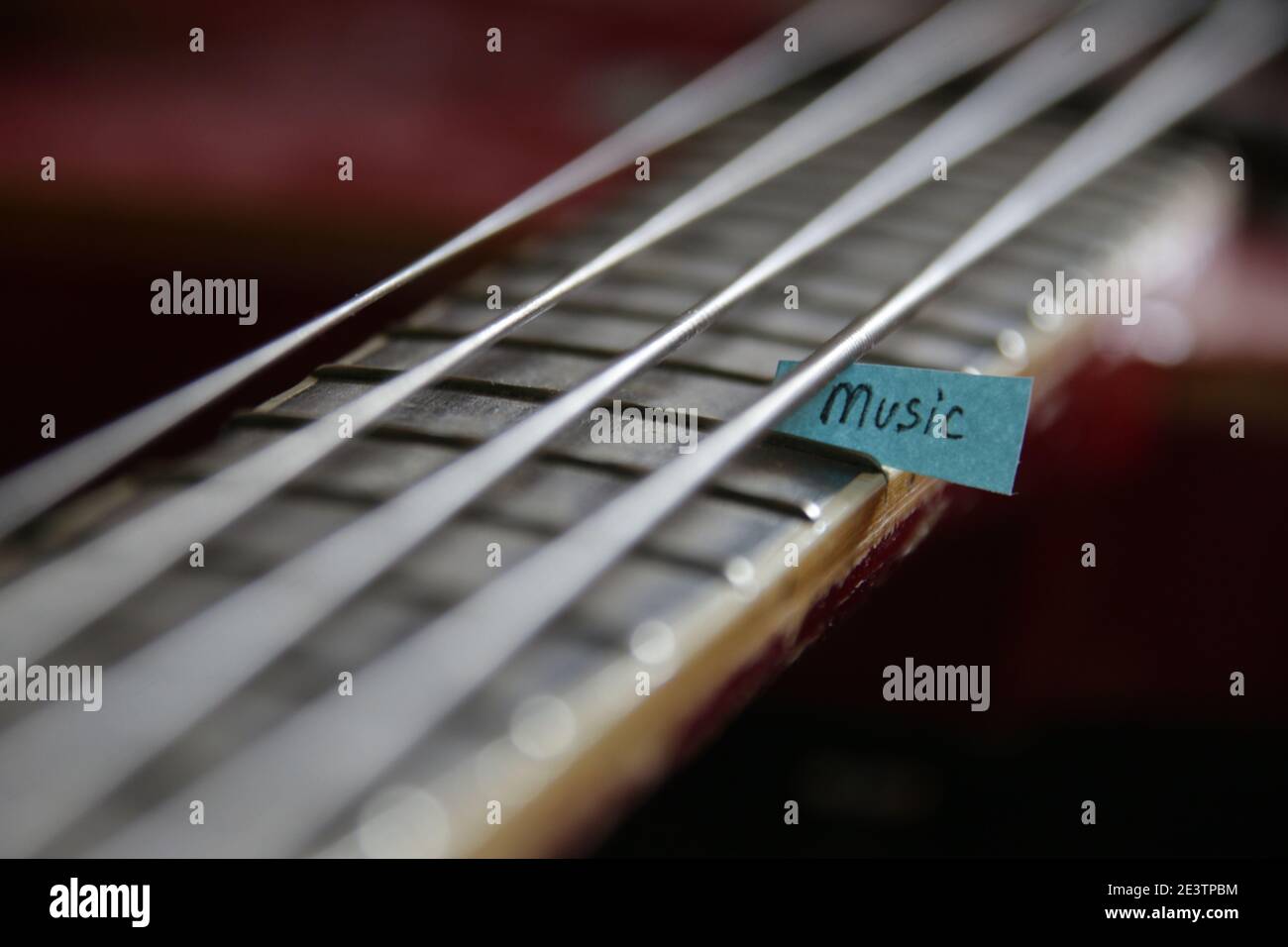 Music creative concept. Label and bass strings Stock Photo - Alamy