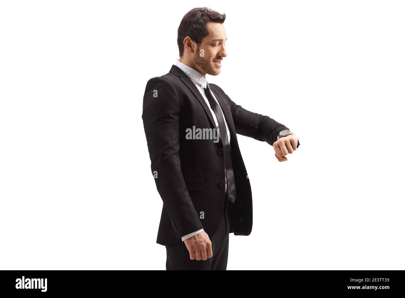 Man in a suit checking his watch isolated on white background Stock ...
