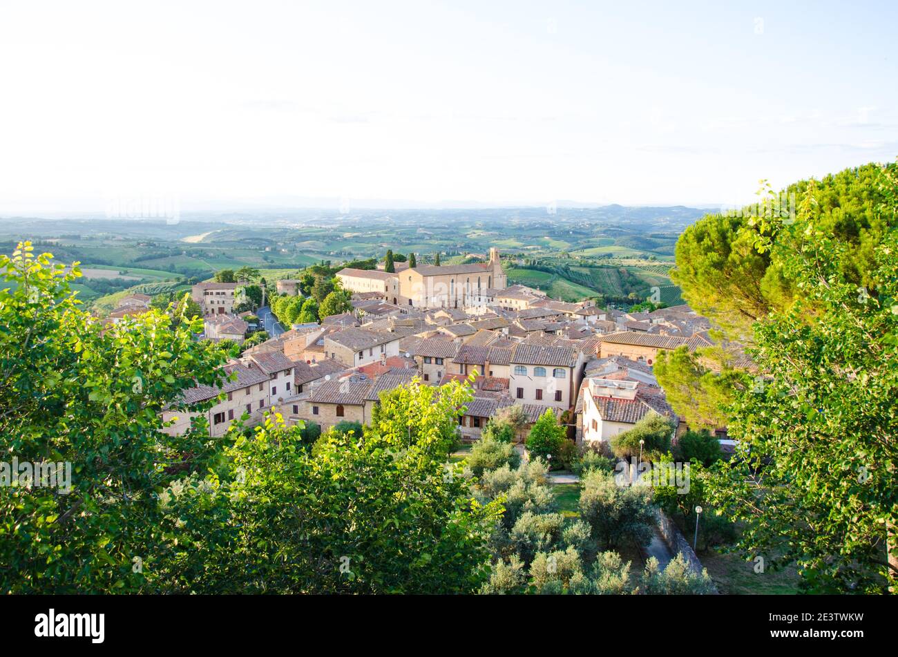 A Tuscan landscape with Sant'Agostino church in San Gimignano, Italy ...